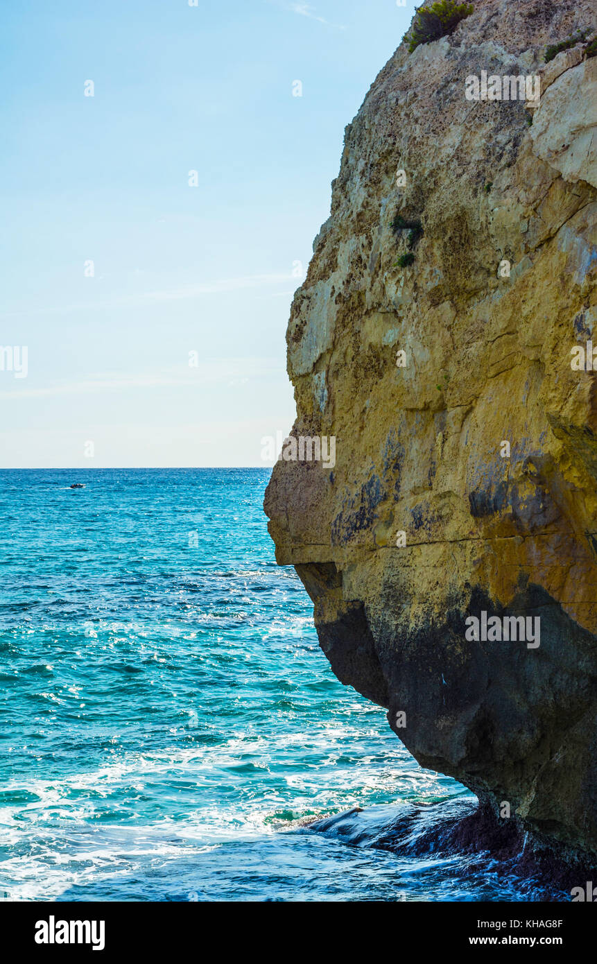 high cliff above the sea, summer sea background, many splashing waves ...