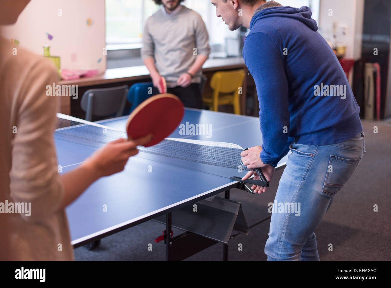 group of young startup business people playing ping pong tennis at ...