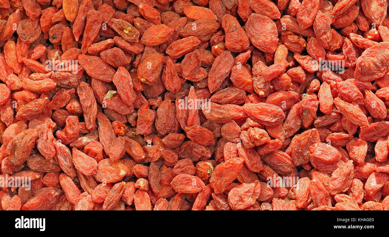 background of red ripe goji berries in the asian market Stock Photo - Alamy