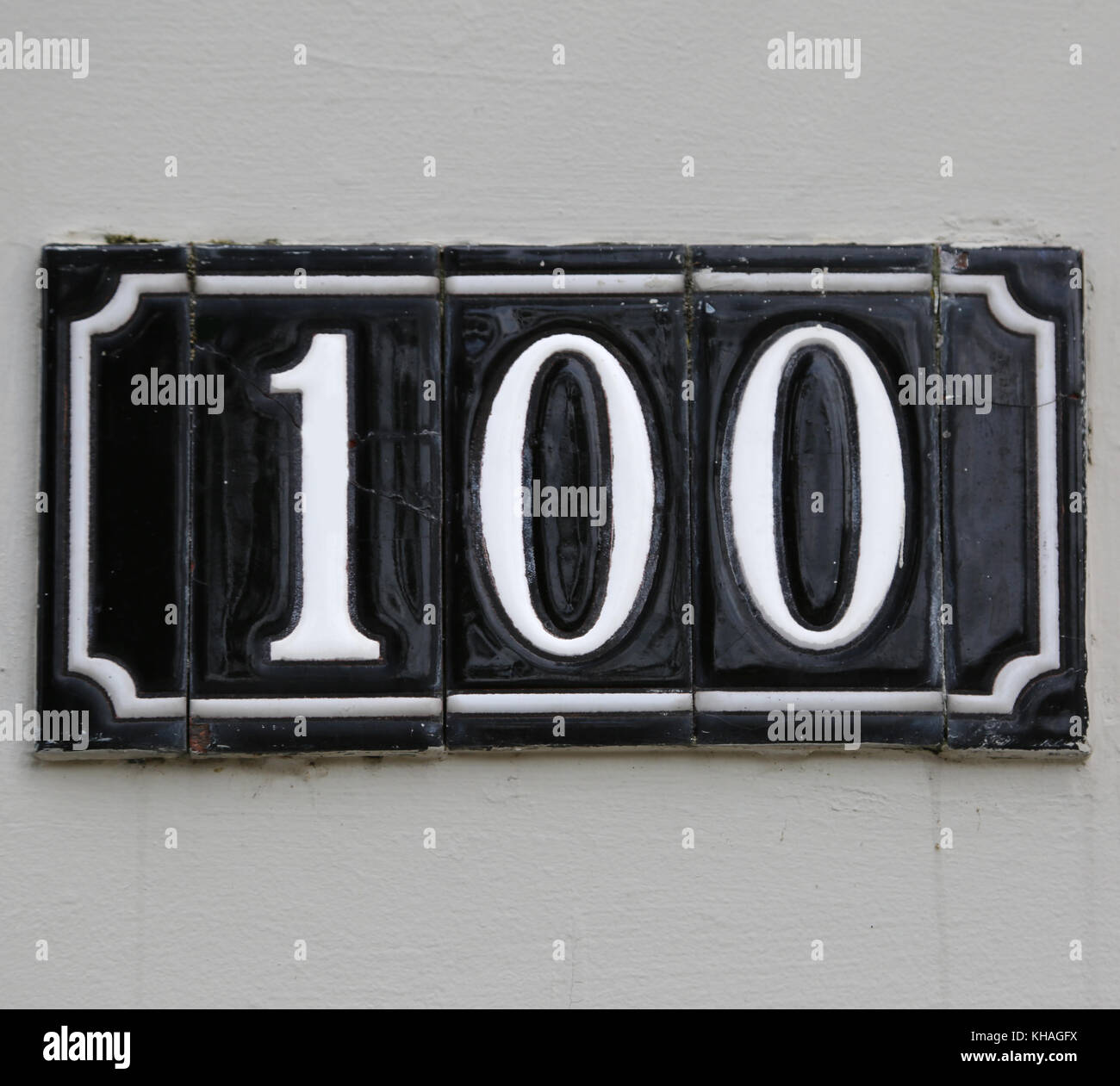 great writing with number 100 made with polished tiles Stock Photo - Alamy