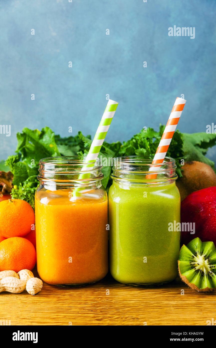Freshly blended fruit smoothies of various colors and tastes in glass ...