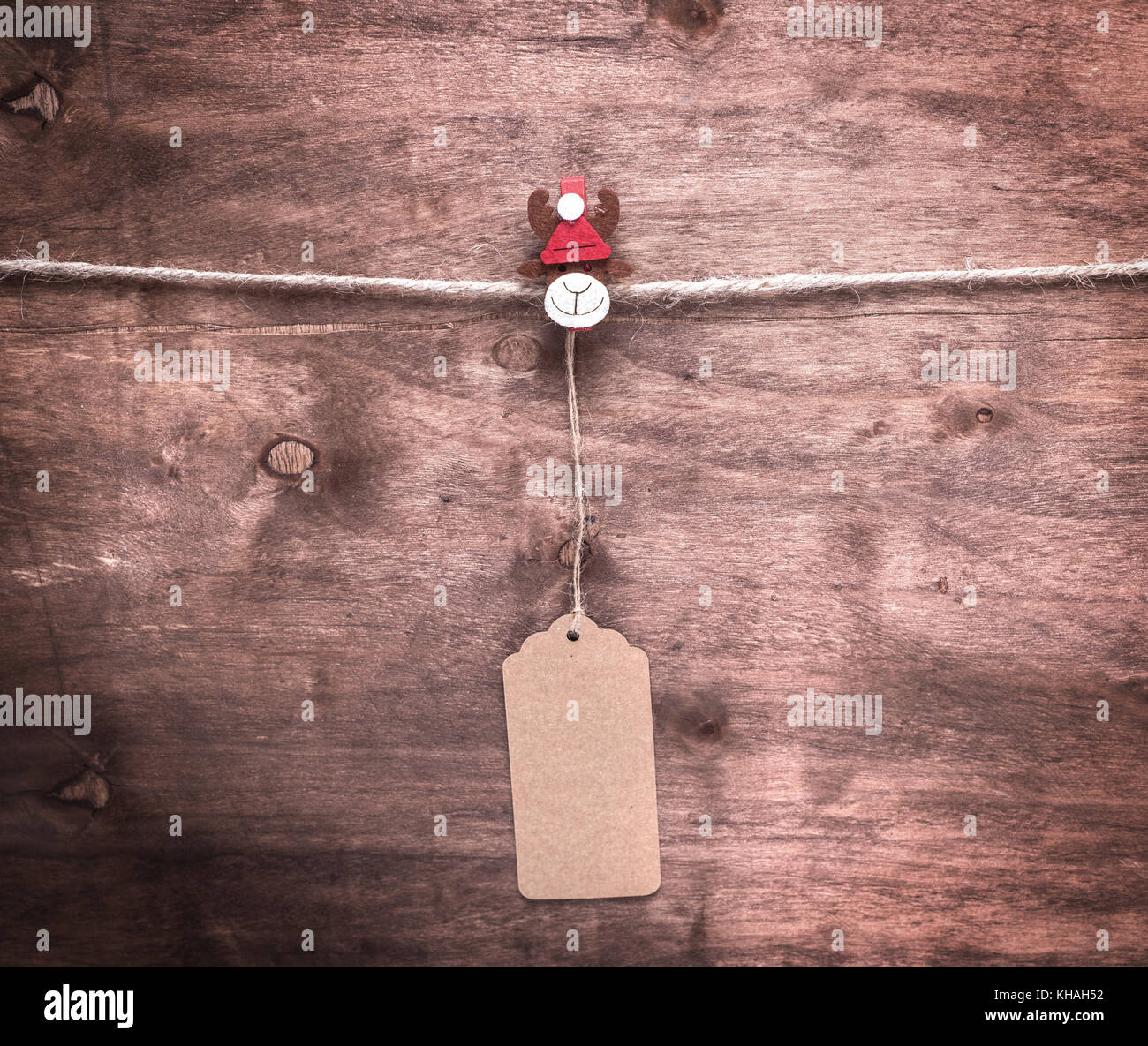 brown empty paper tag hanging on decorative festive clothespin Stock ...