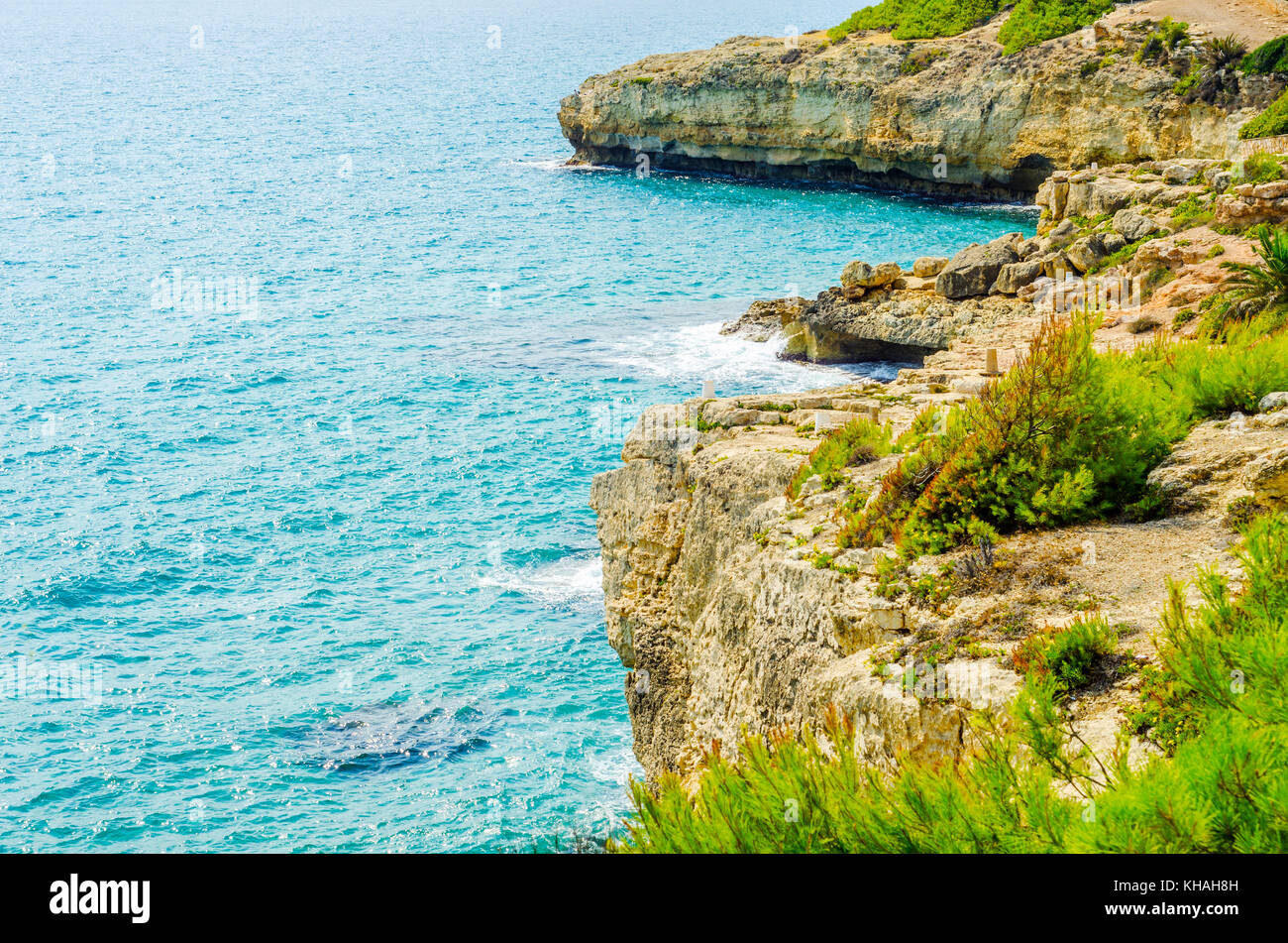 high cliff above the sea, summer sea background, many splashing waves ...