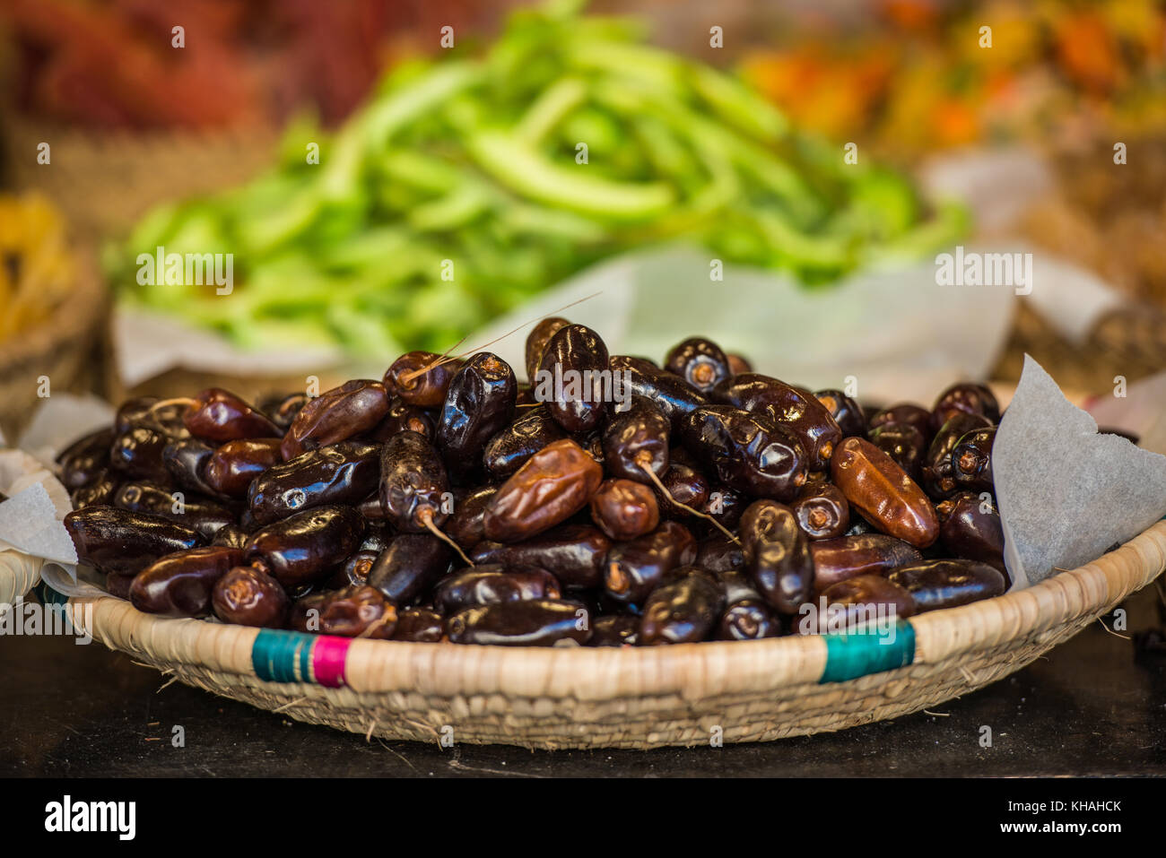 Detail of a basket of dates in a stall of the medieval market of the ...