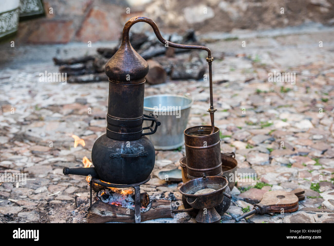 An alembic on the fire in a medieval market in Cáceres, Spain Stock ...