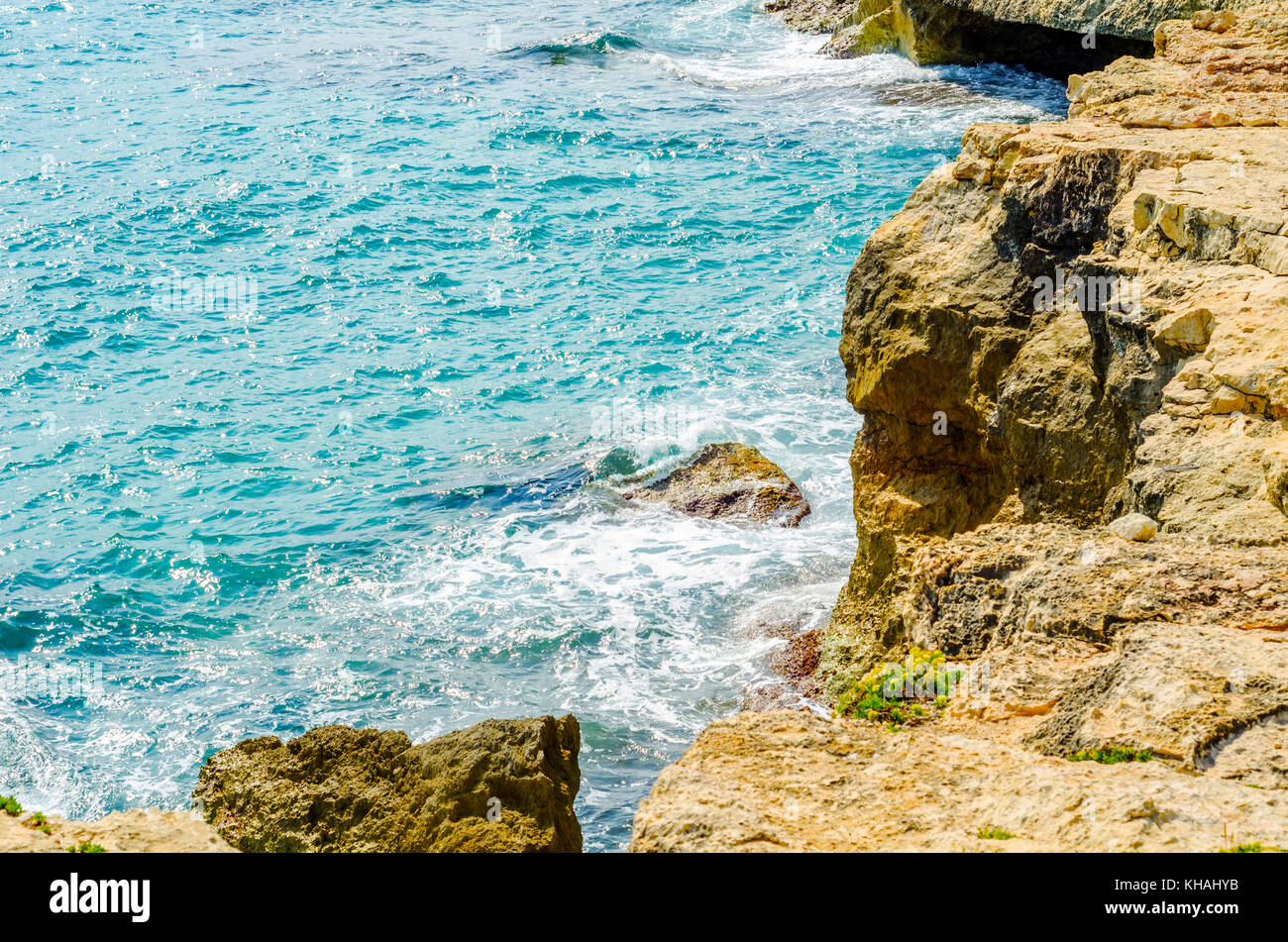 high cliff above the sea, summer sea background, many splashing waves ...