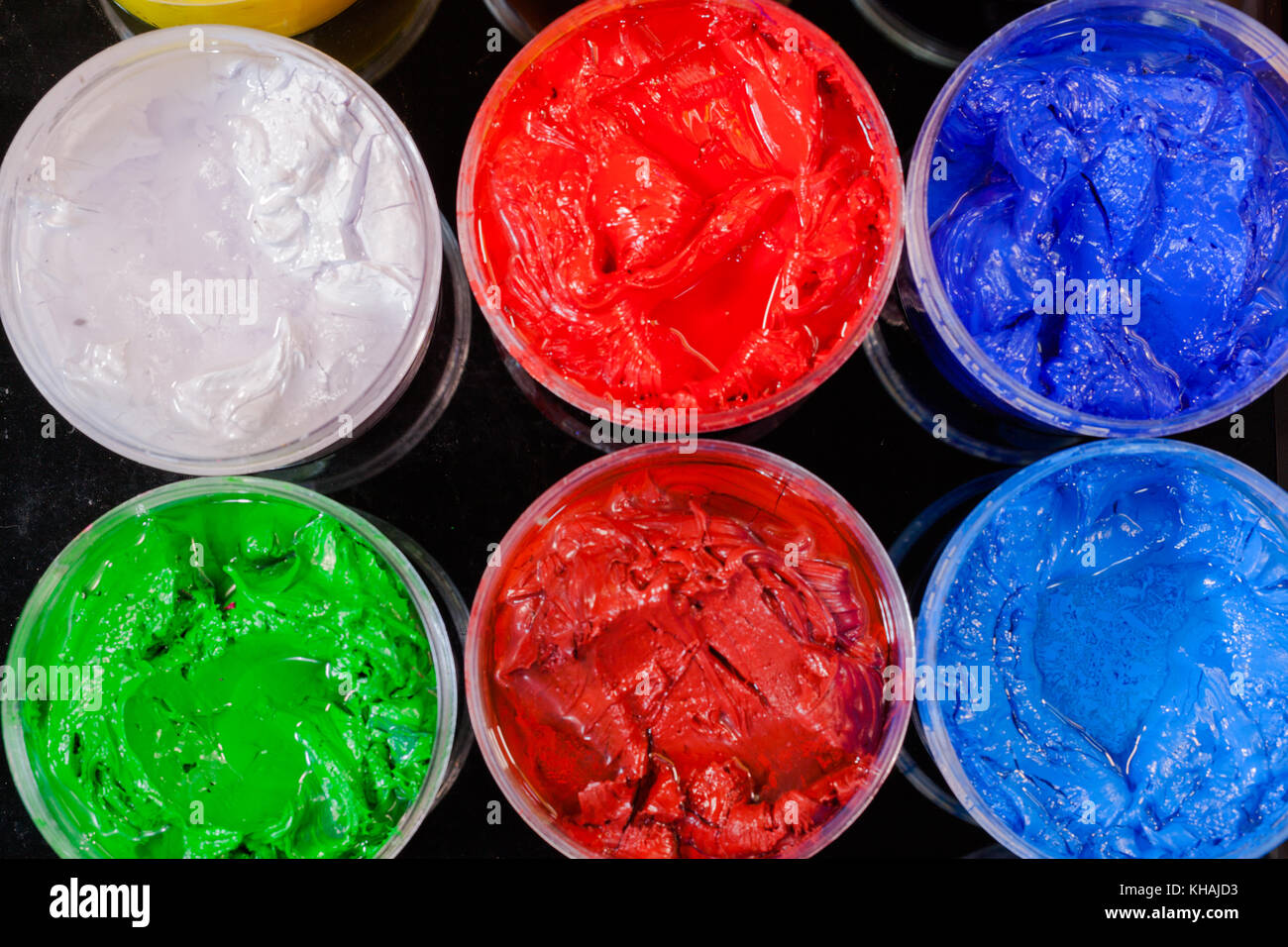 several plastisol ink cans in factory who use plastisol ink to Stock ...