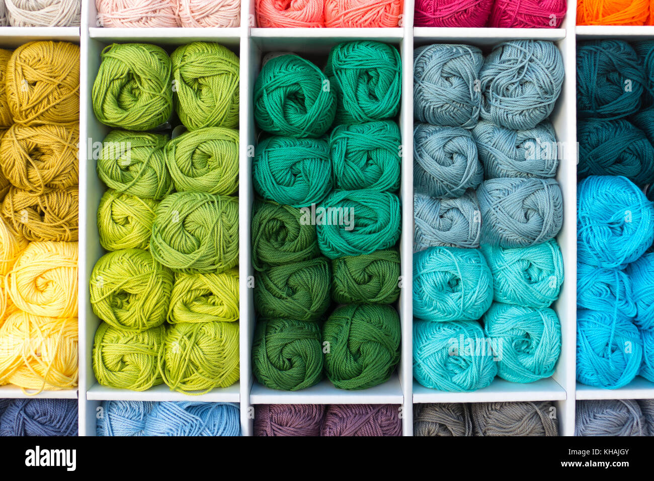 Stacked colorful ball of wool in a box Stock Photo - Alamy