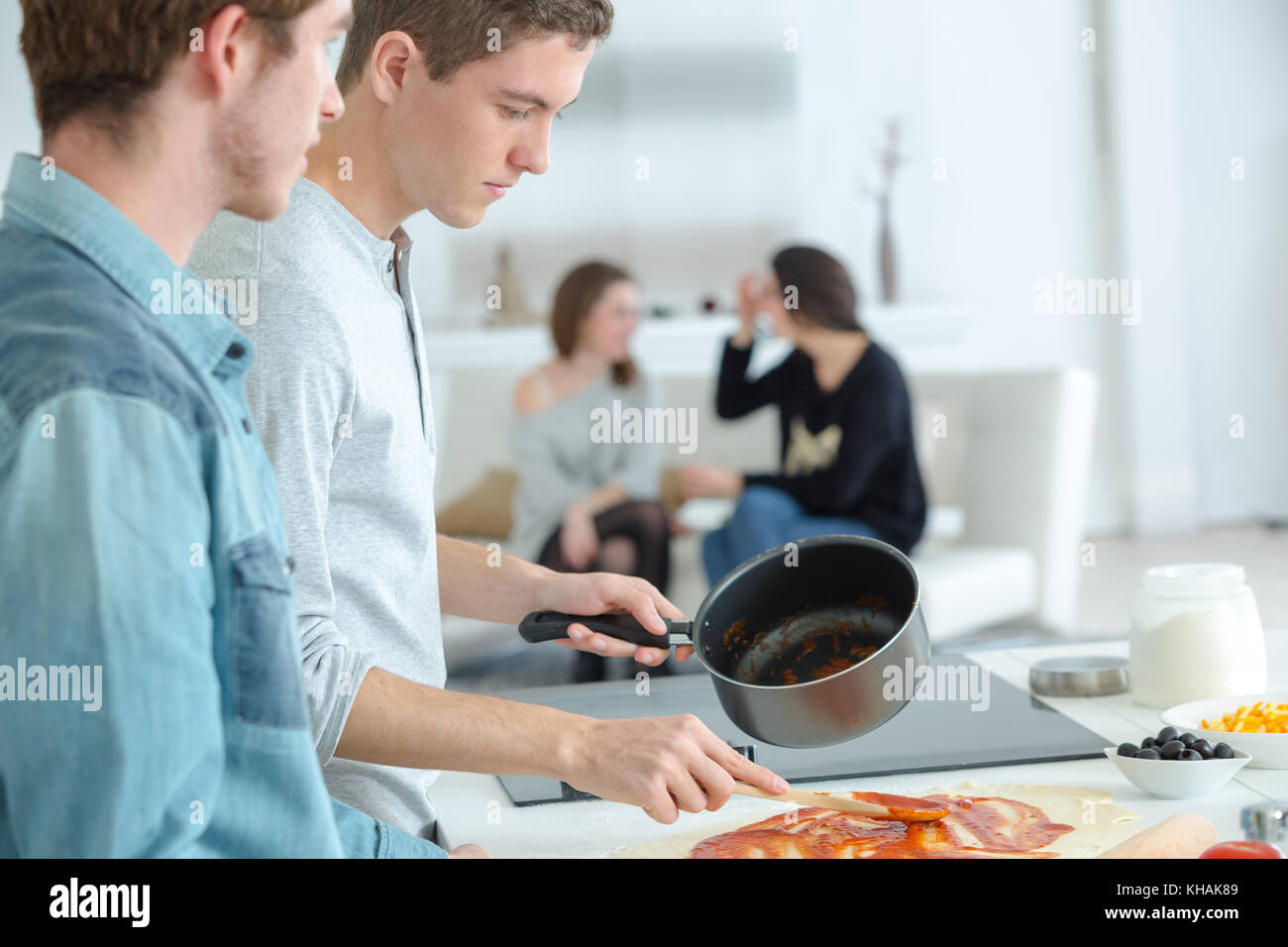 young men cooking Stock Photo - Alamy