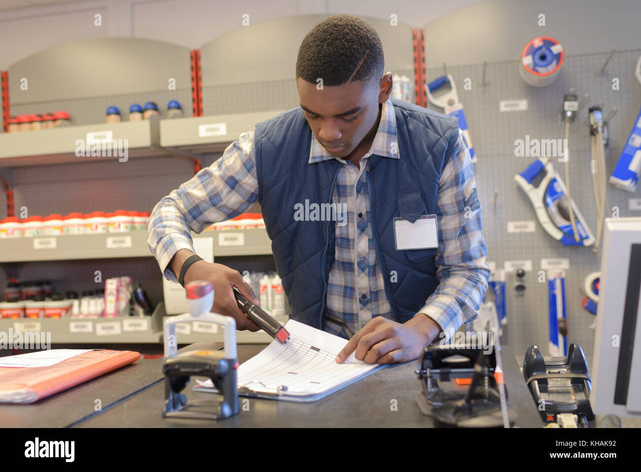 staff managing warehouse logistics in an on-site office Stock Photo - Alamy