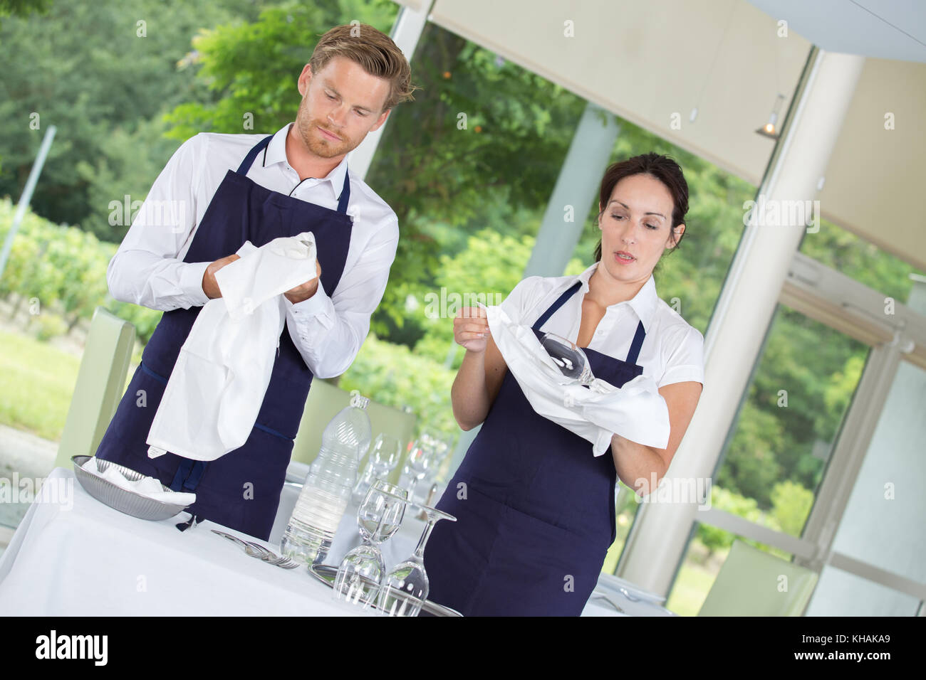 waiters setting wedding table at restaurant Stock Photo - Alamy