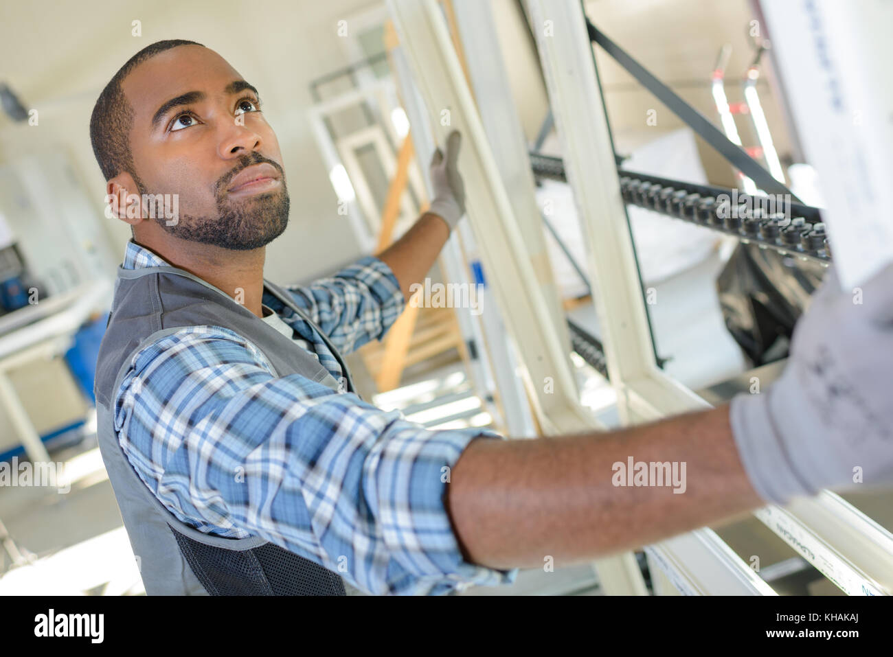 Man holding window frame Stock Photo - Alamy