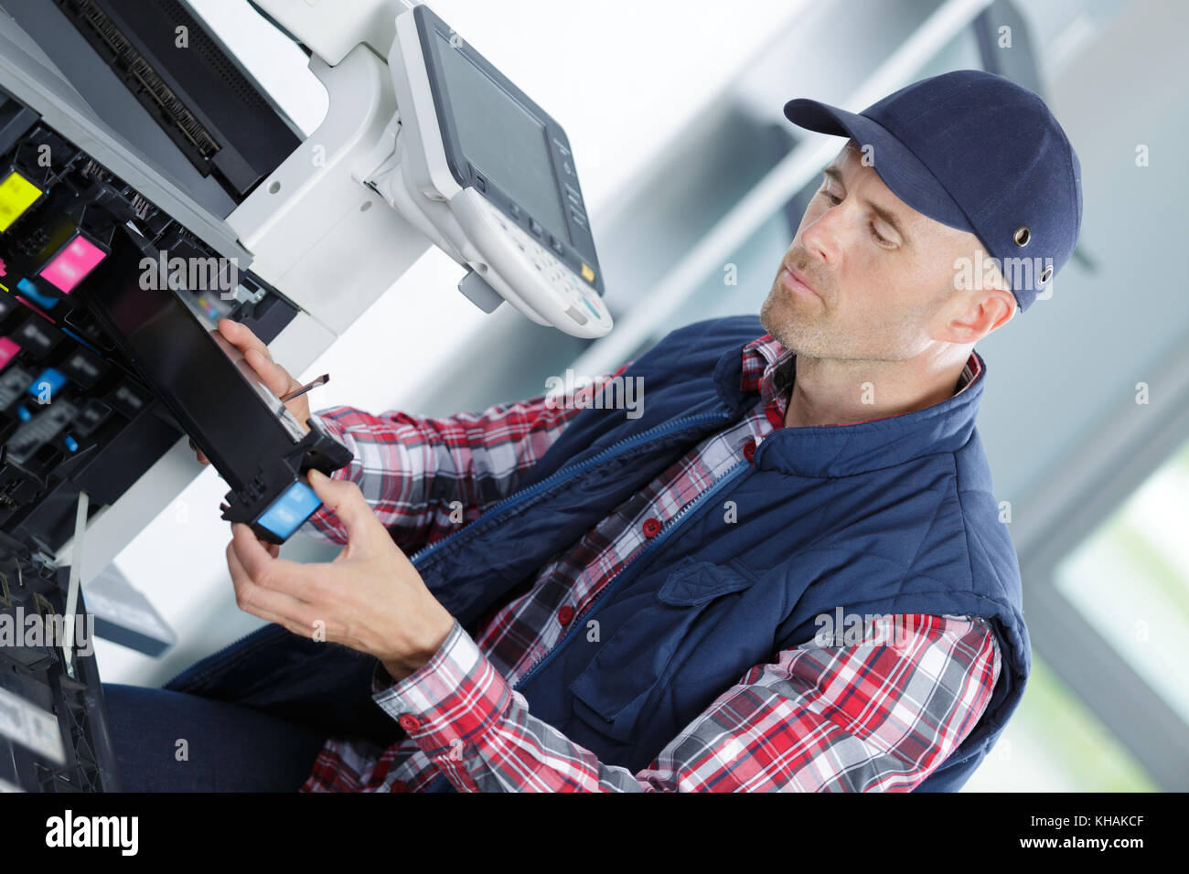shot handsome technician fixing photocopier machine Stock Photo - Alamy