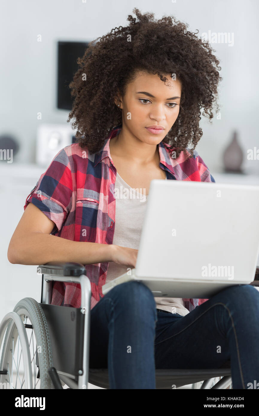 disabled woman in wheelchair with laptop Stock Photo - Alamy