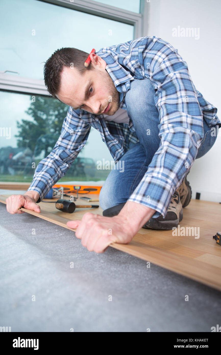 man working on wood floor Stock Photo - Alamy