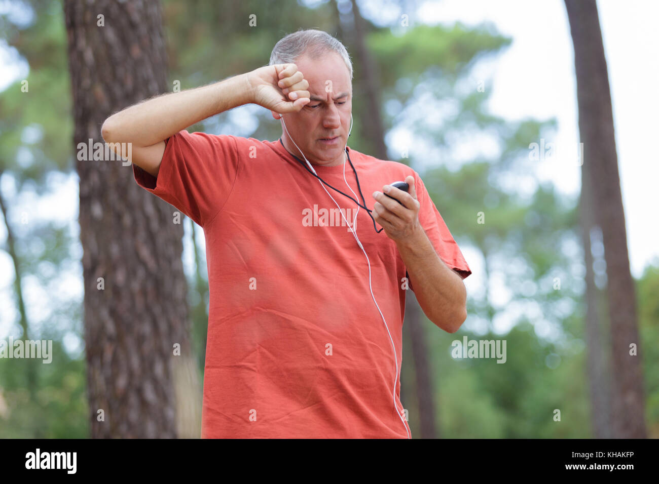 middle-age man very tired from a long jogging distance Stock Photo - Alamy