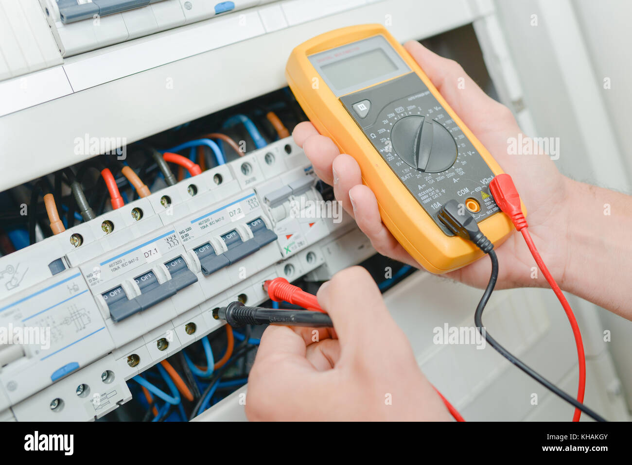 Electrician hands test electrical current hi-res stock photography and ...