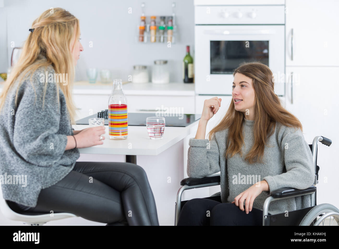 woman visiting the handicapped friend Stock Photo - Alamy