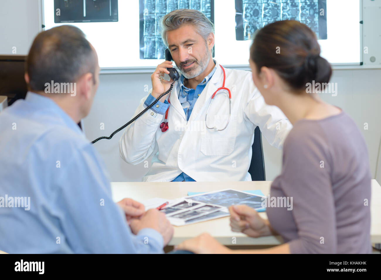 doctor talking on the phone Stock Photo - Alamy