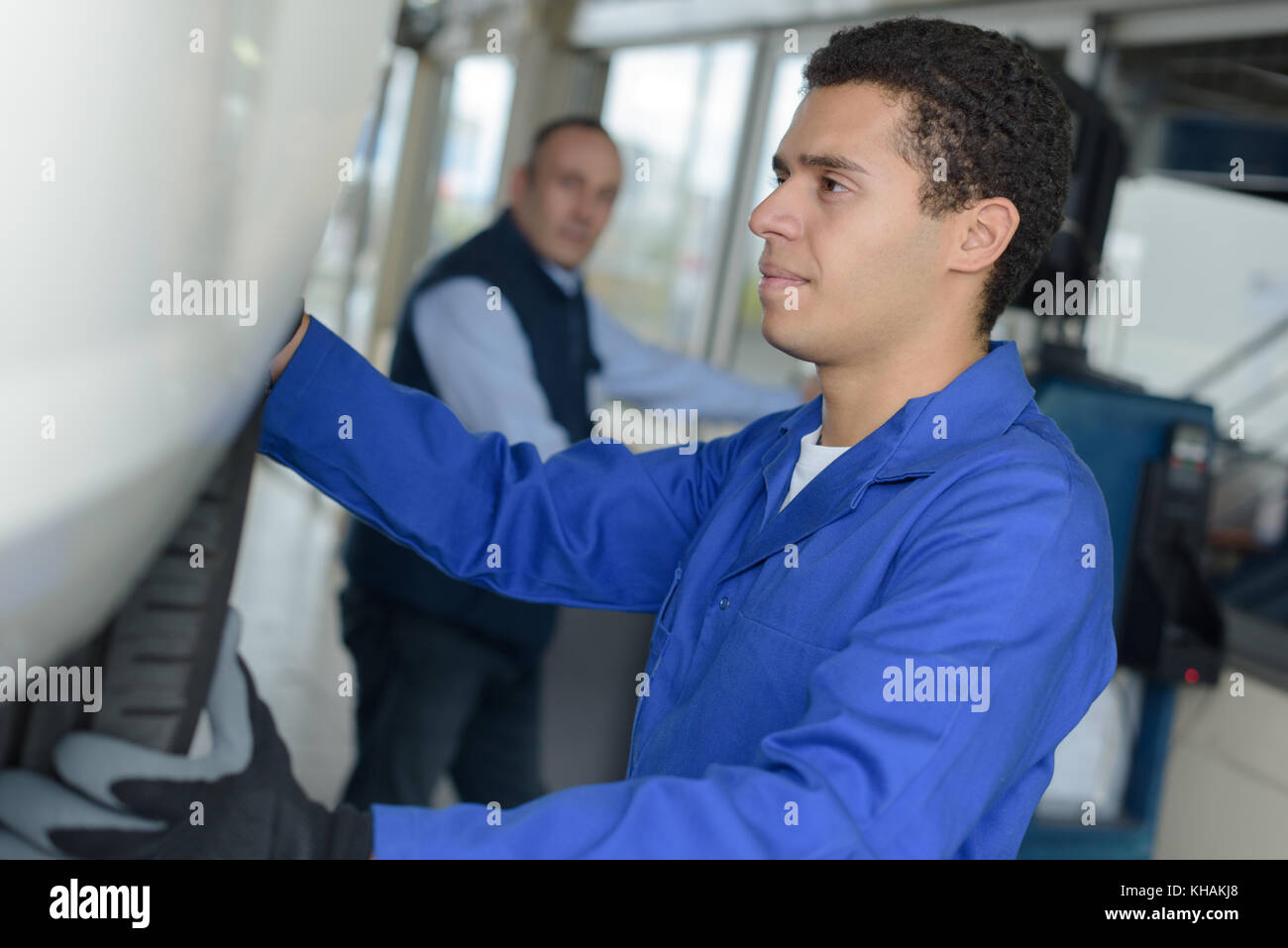 professional industrial engineer adjusting modern machine settings ...