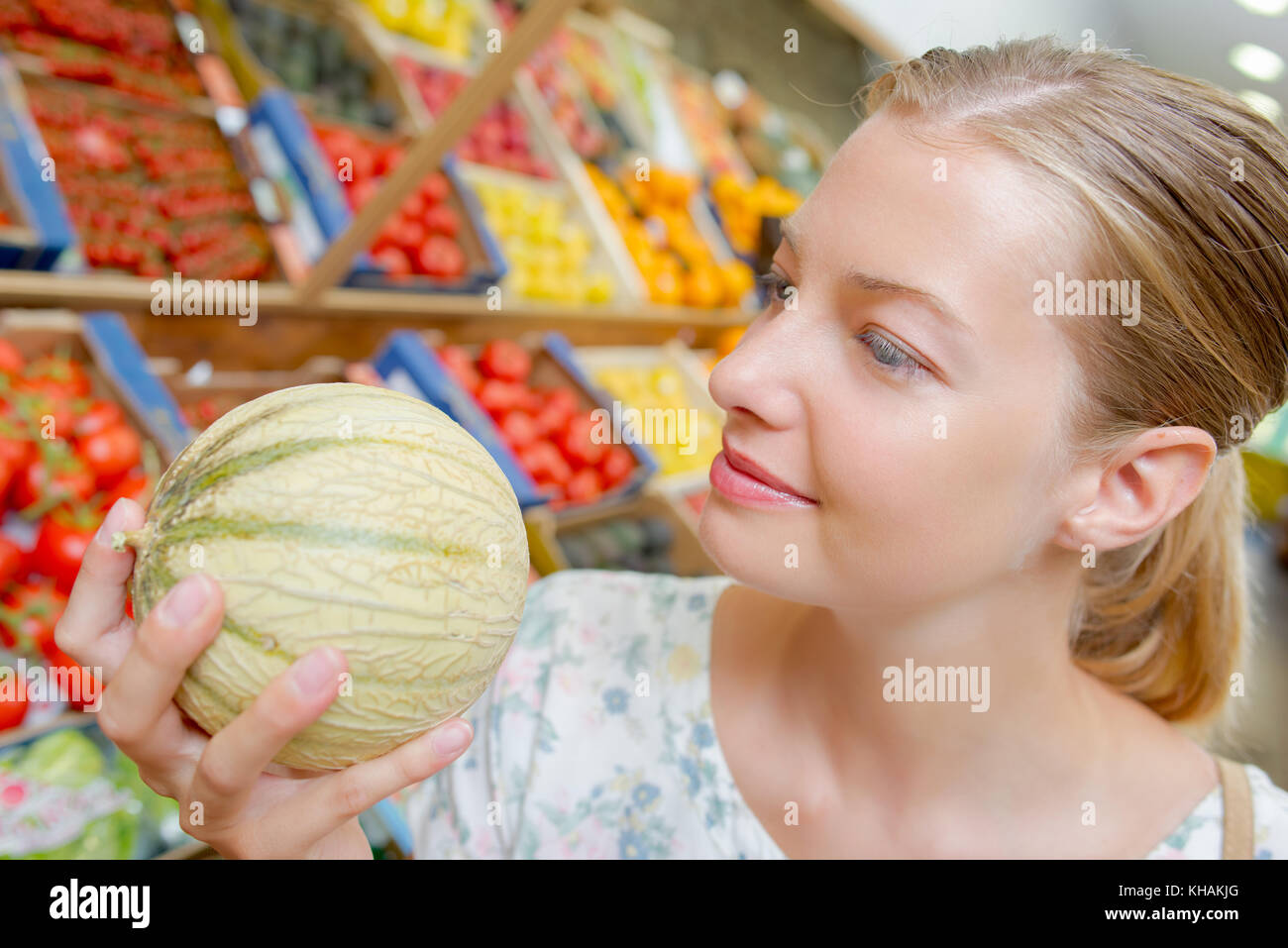 woman buying melon Stock Photo - Alamy