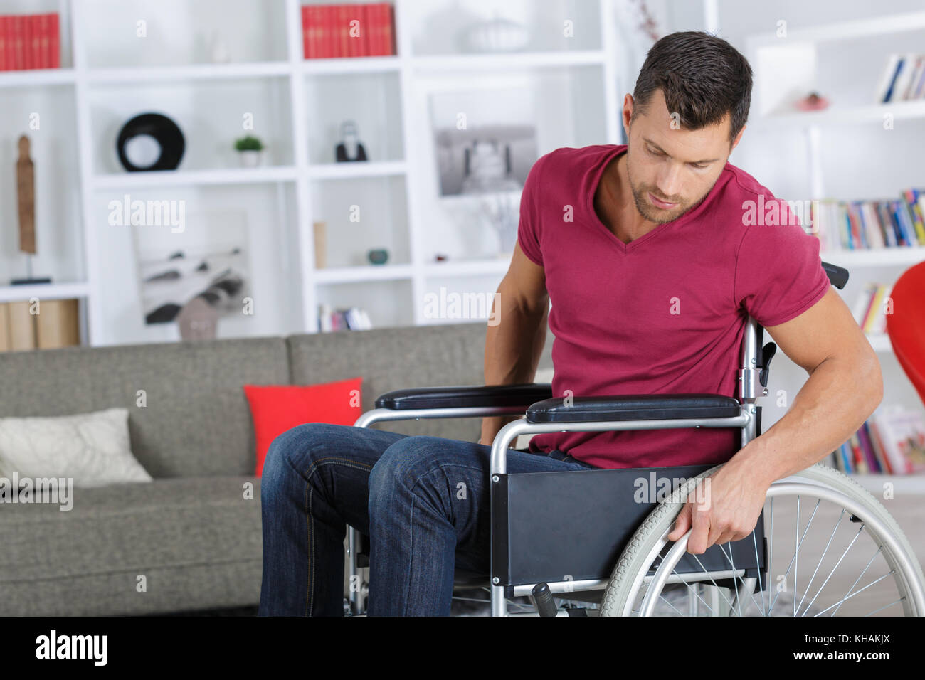 handsome man in his 40s sitting in wheelchair Stock Photo - Alamy