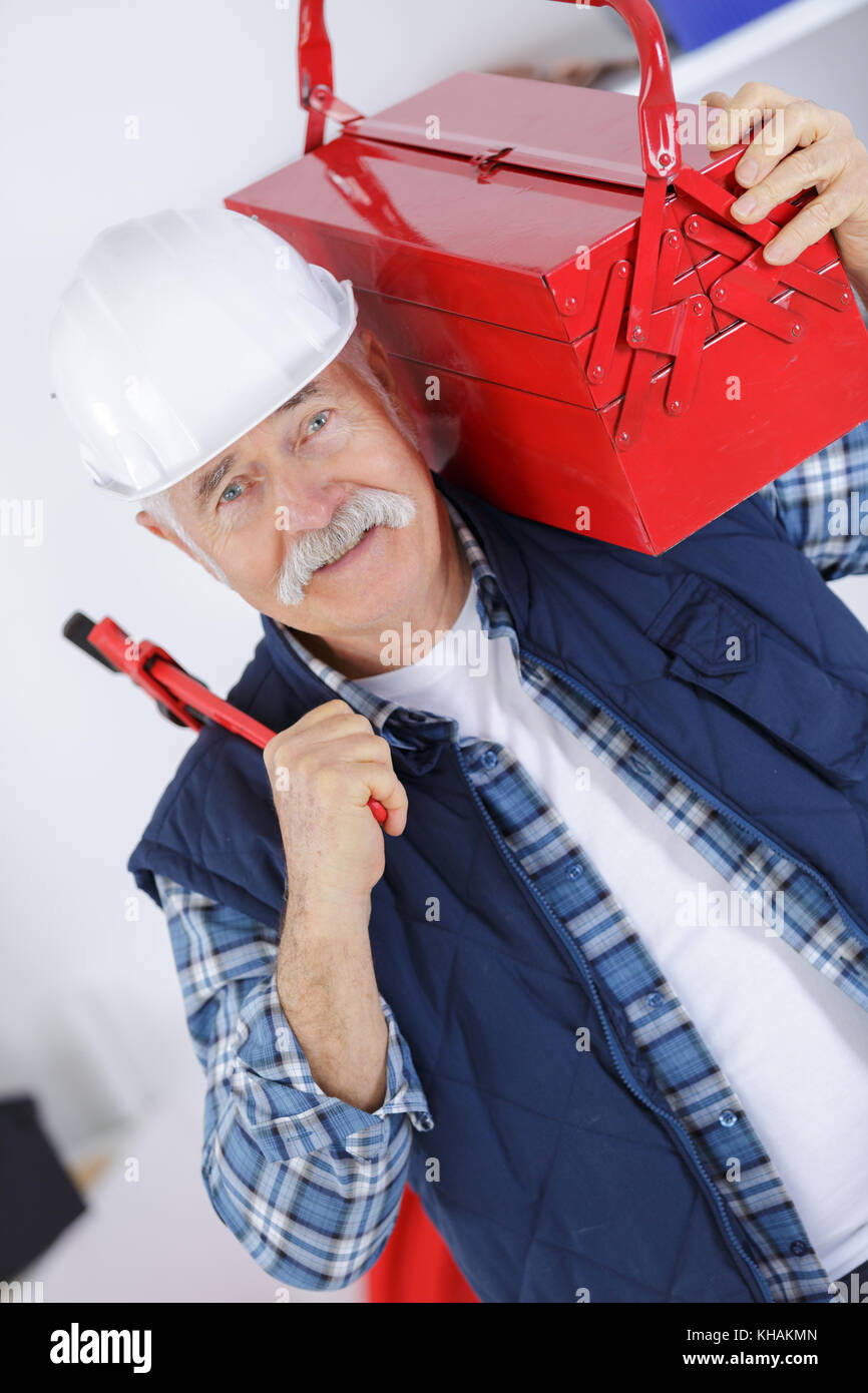 portrait of worker wearing jacket and helmet Stock Photo - Alamy