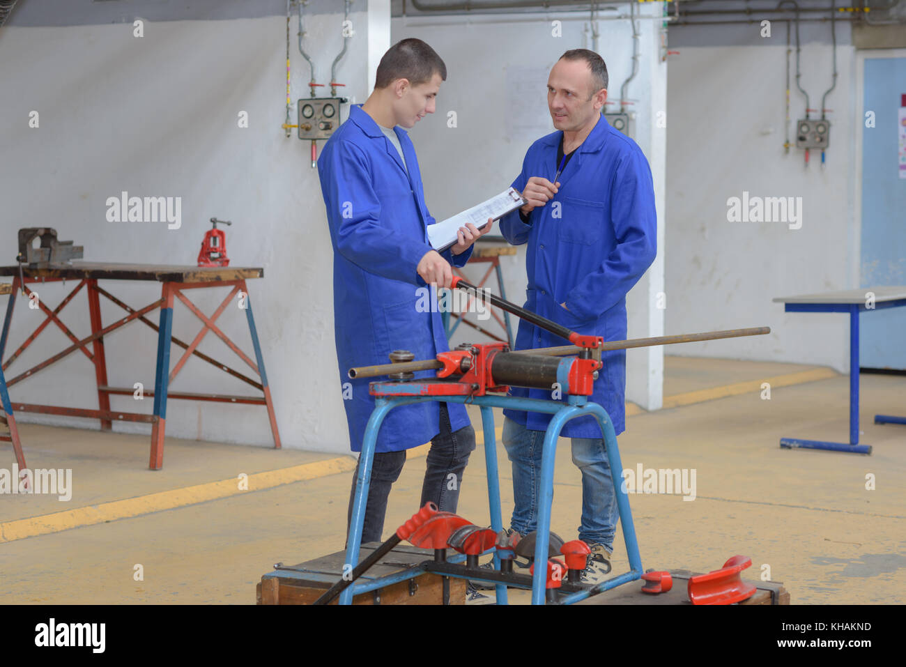 apprentice learning in a factory Stock Photo - Alamy