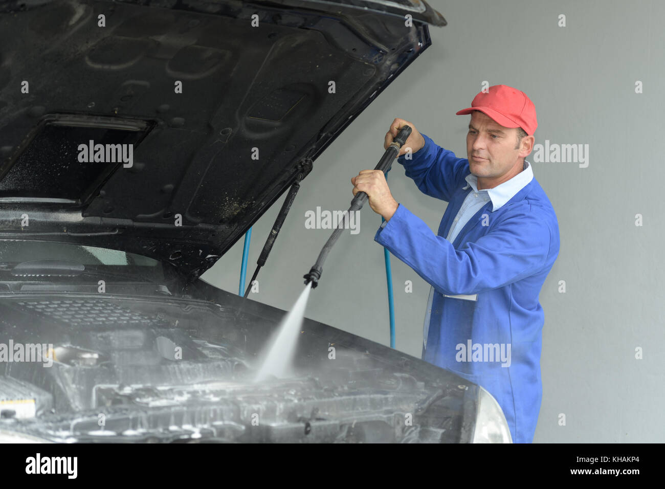 pressure cleaning the vehicles boot Stock Photo - Alamy