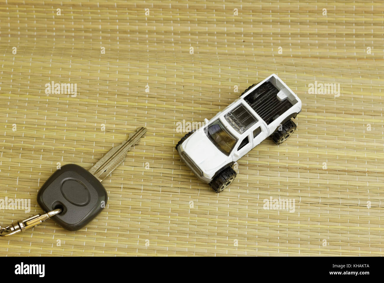 A car key and mini white pick up truck. Concept Stock Photo - Alamy