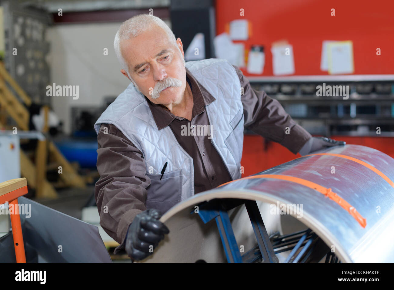 senior worker at a factory Stock Photo - Alamy