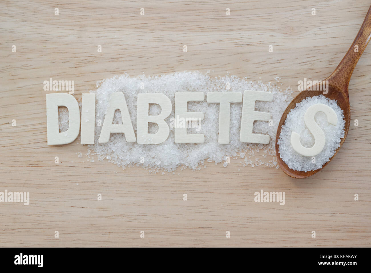 Diabetes concept. Alphabet with word DIABETES with sugar and wooden ...