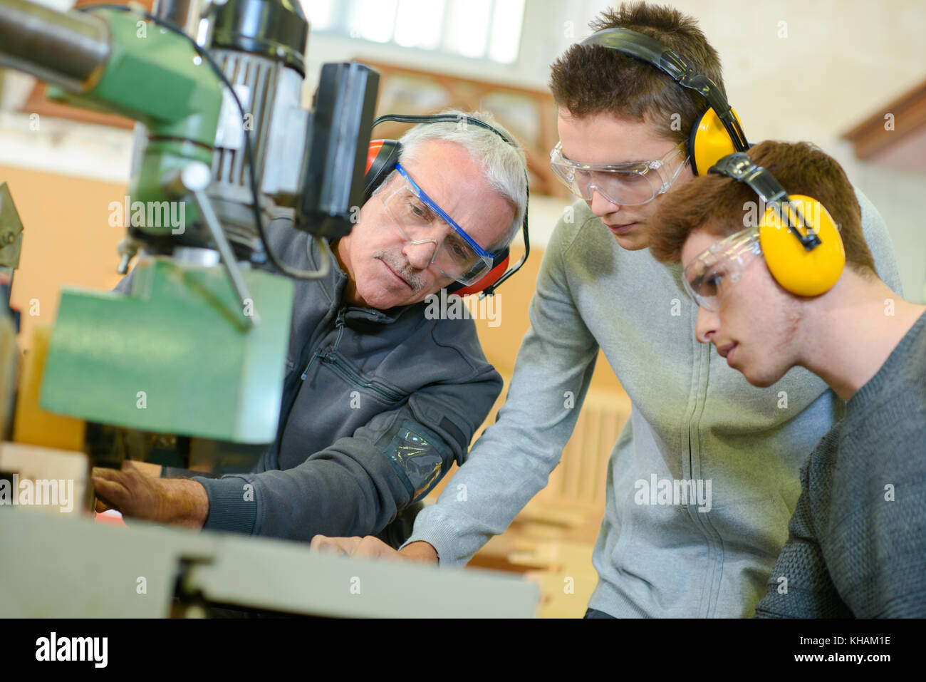 apprentices learning to use industrial machine Stock Photo - Alamy