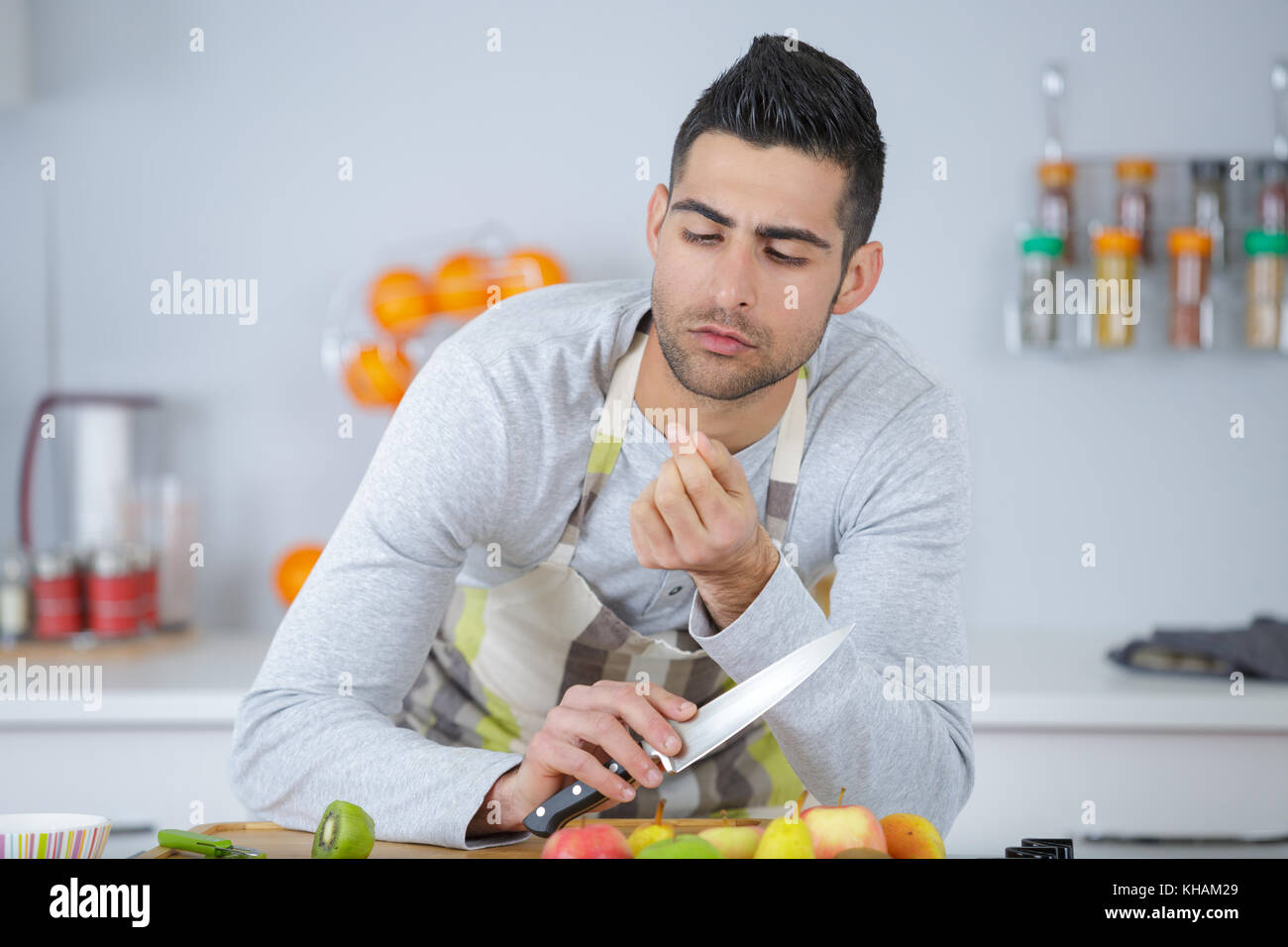crazy chef cutting his finger Stock Photo - Alamy