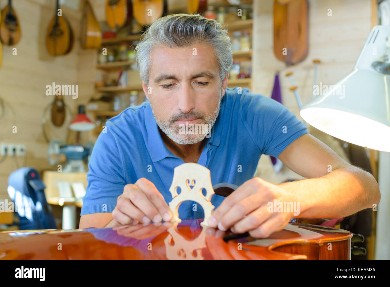 fitting the viola bridge Stock Photo - Alamy