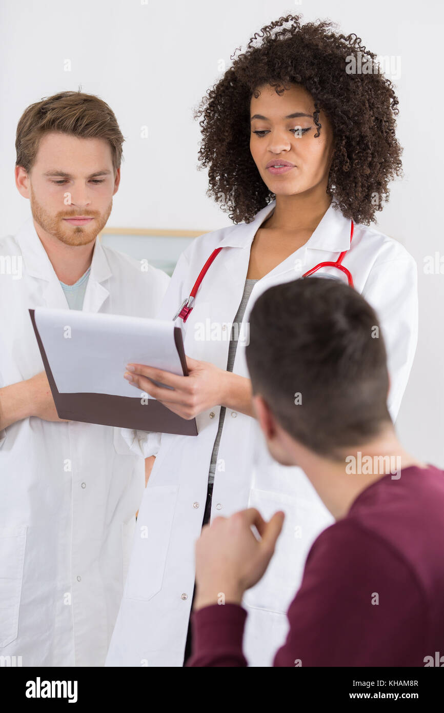 doctor holding a clipboard with a patient medical record chart Stock ...
