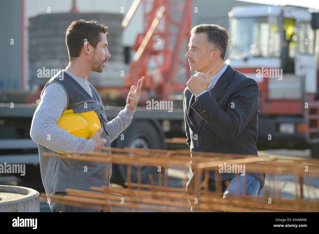 factory workers discussing outside a factory Stock Photo - Alamy