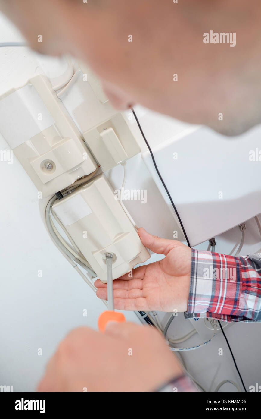Electrician removing plastic cover Stock Photo - Alamy