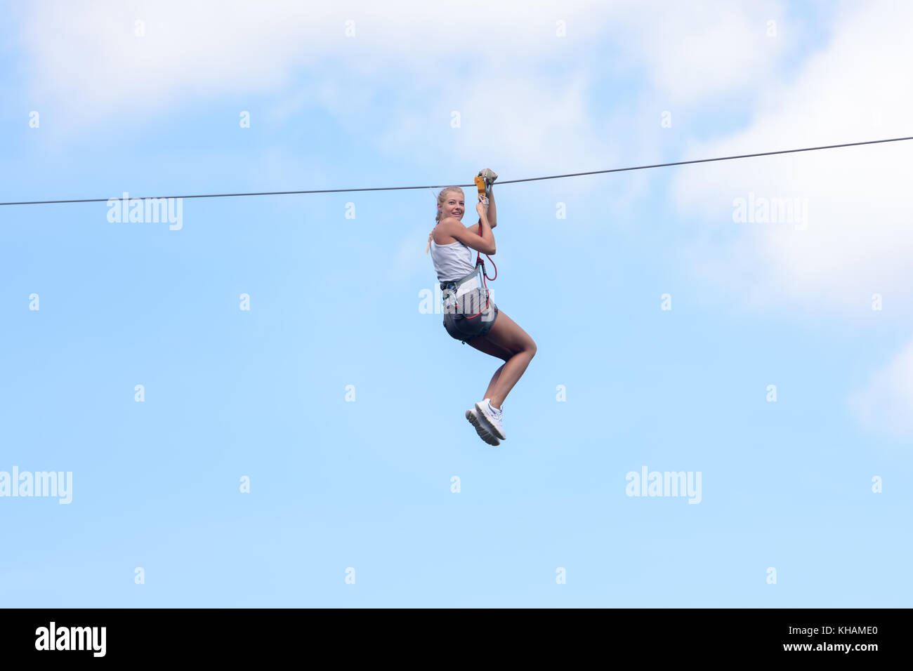 woman going on a zipline adventure Stock Photo - Alamy