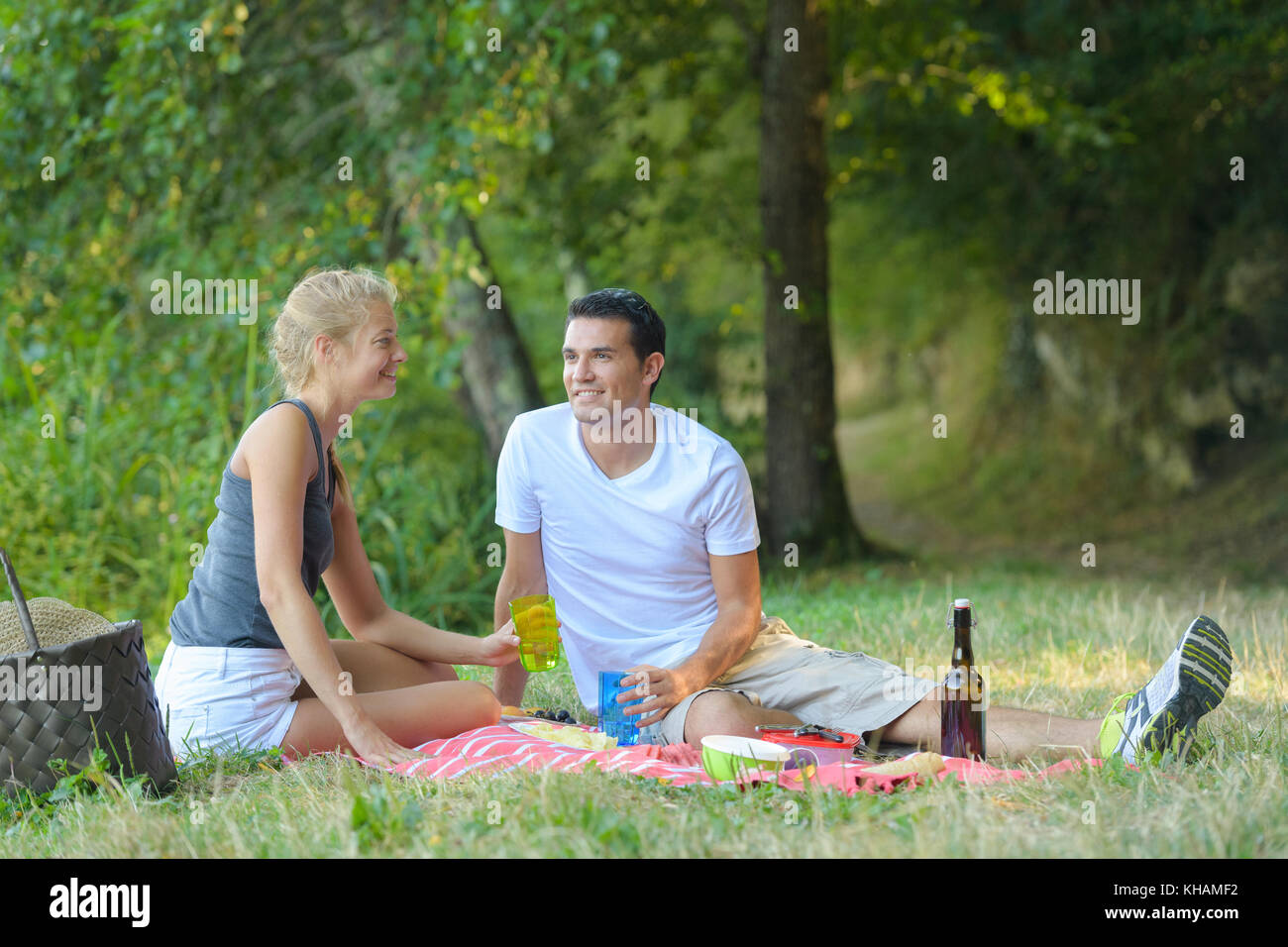 romantic couple having picnic in park Stock Photo - Alamy