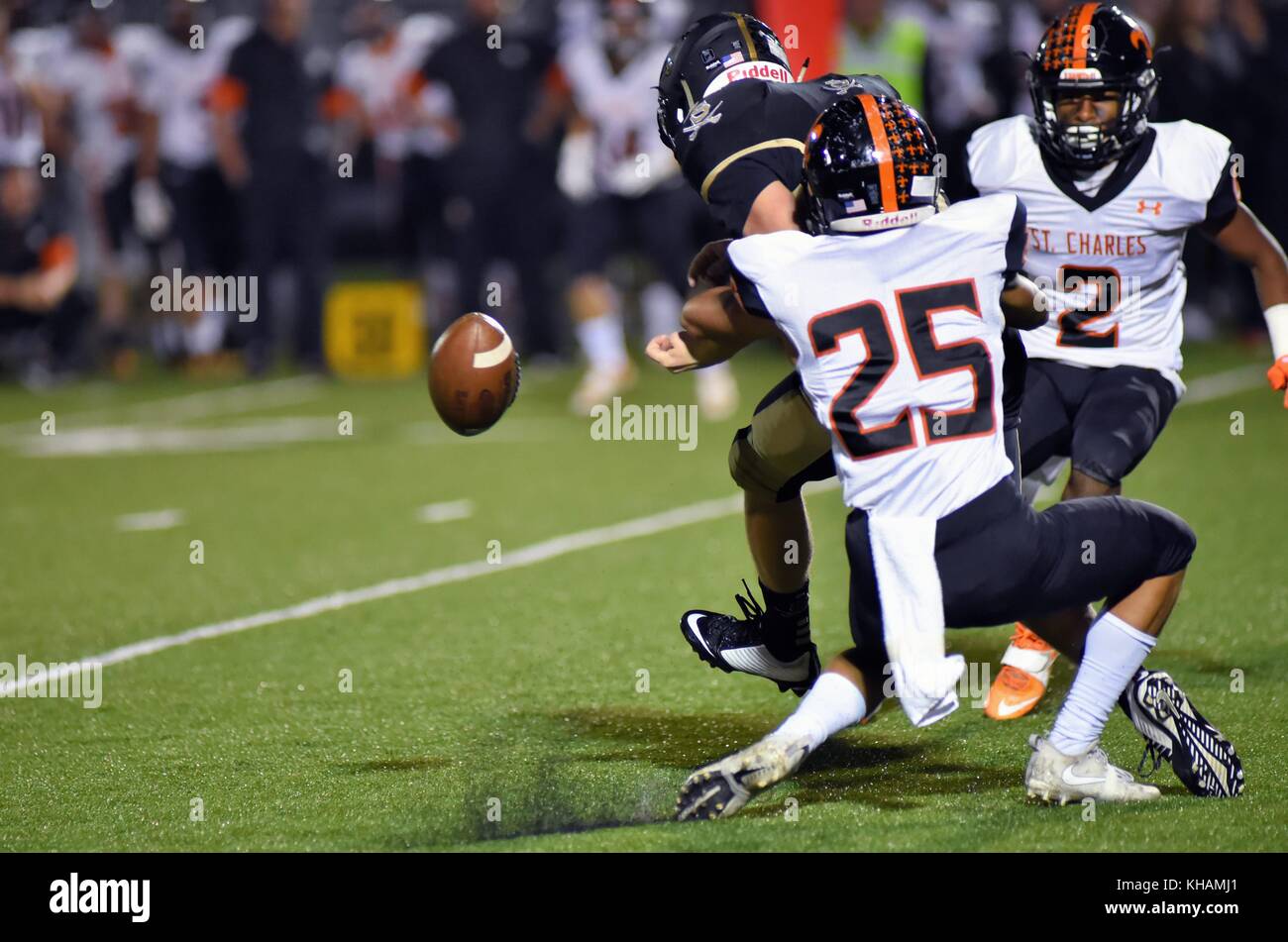 Pass receiver being hit by a defender as a pass fell incomplete during ...