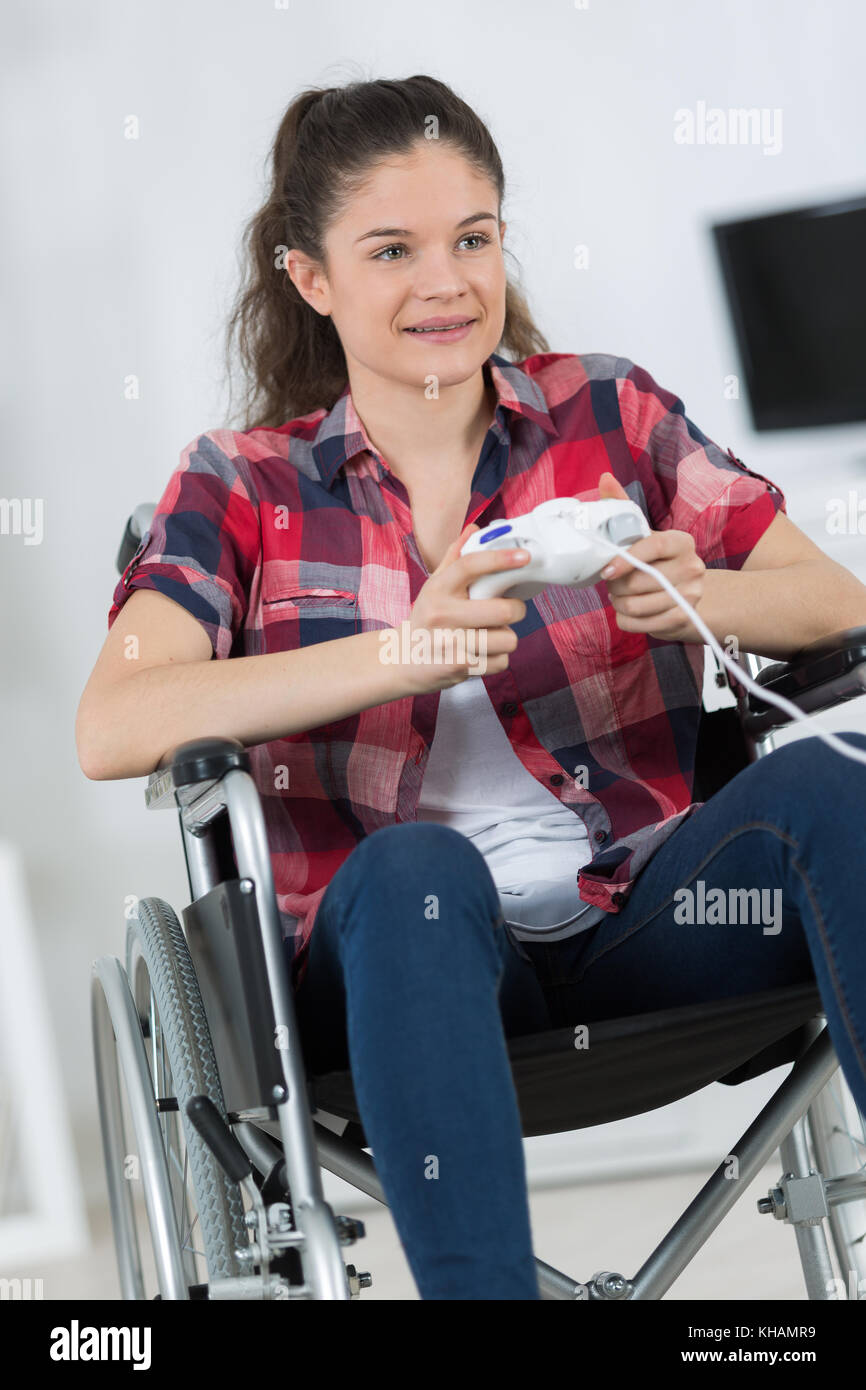 disabled young woman playing video game Stock Photo - Alamy