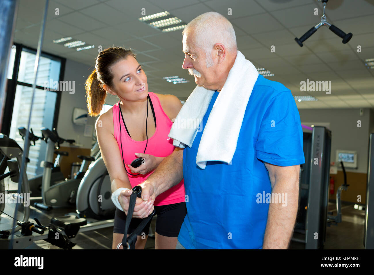 young woman exercising with active happy female senior Stock Photo - Alamy