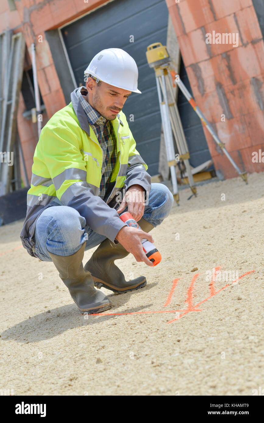 builder measuring a construction site Stock Photo - Alamy