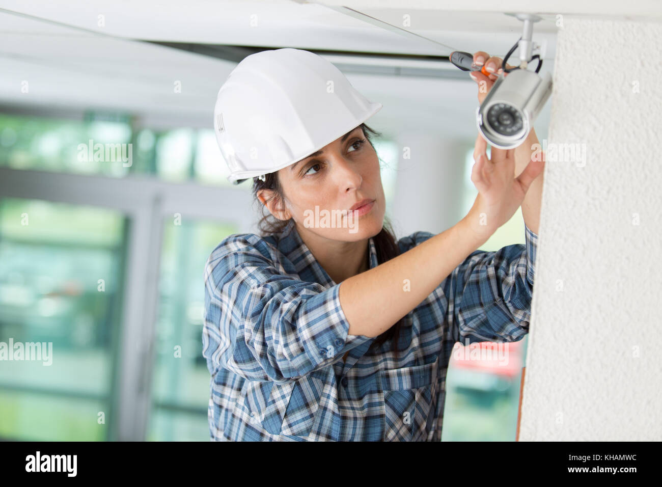 female professional cctv technician working Stock Photo - Alamy