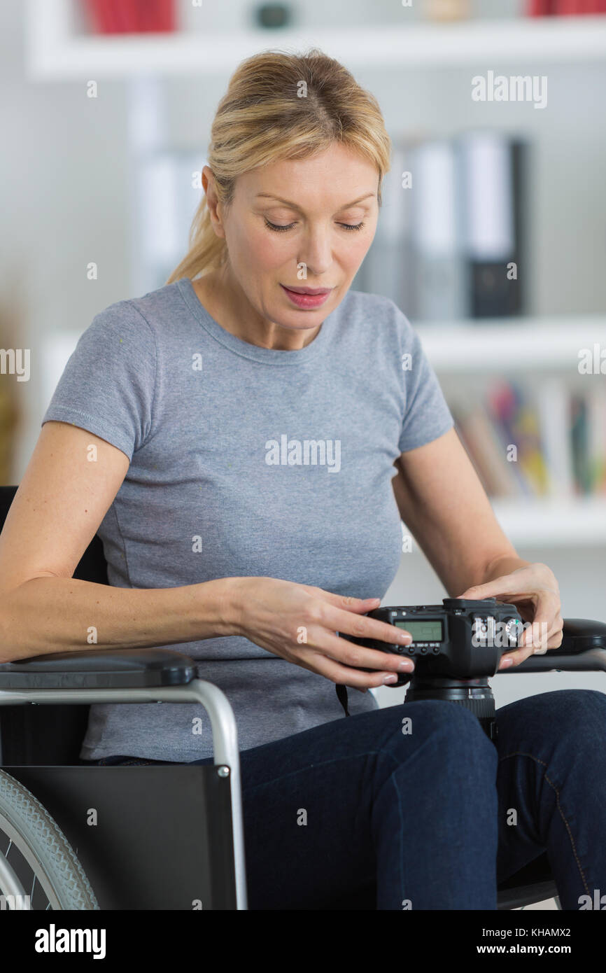 disabled female checking his camera Stock Photo - Alamy