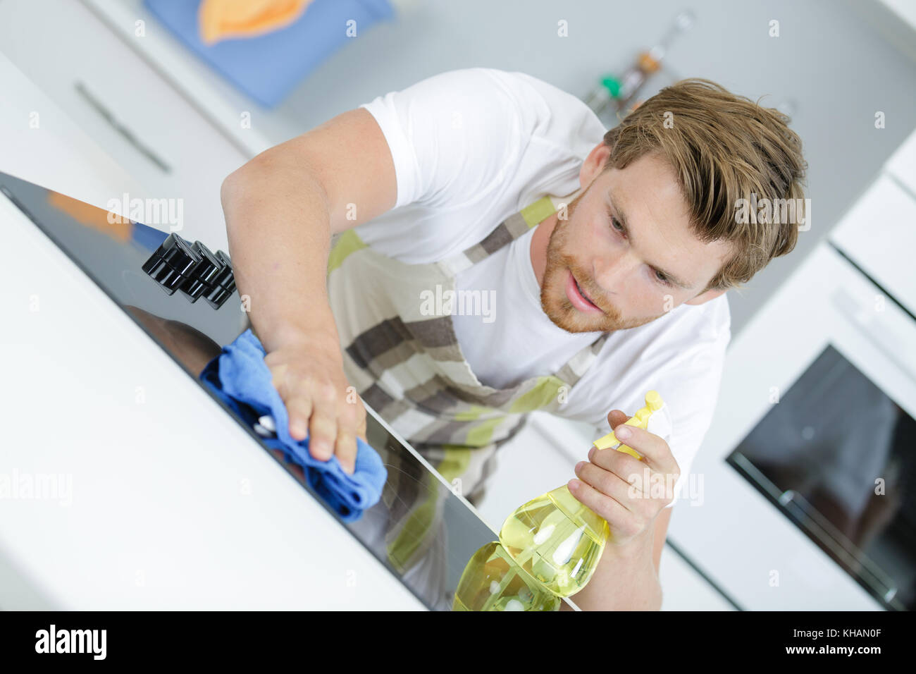 wiping the hob Stock Photo - Alamy