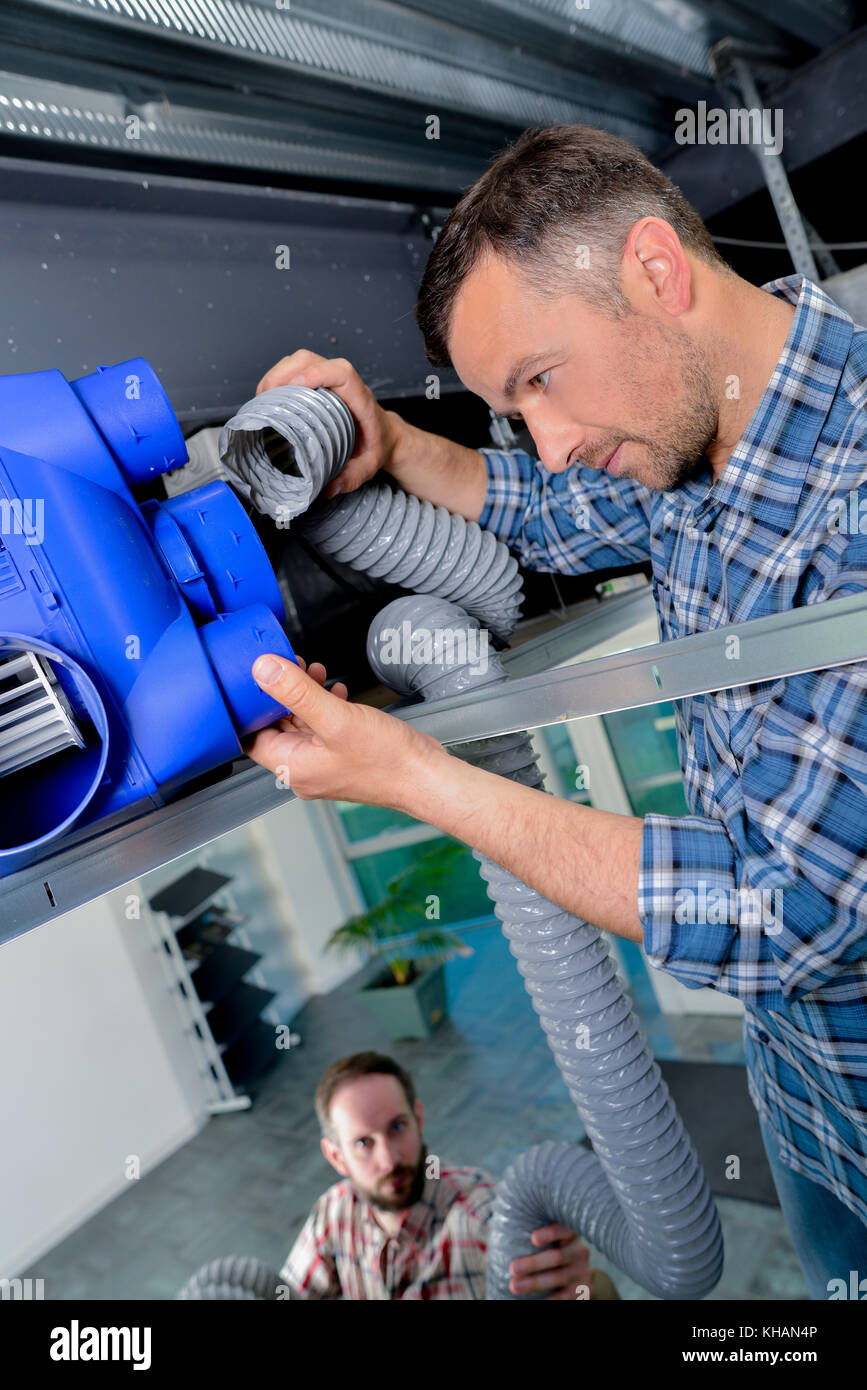 Installing new ventilation system Stock Photo - Alamy