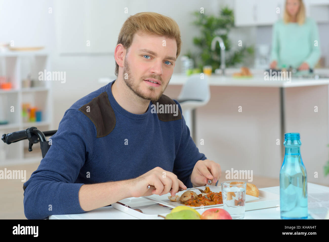 Man eating a meal at the dining table Stock Photo - Alamy