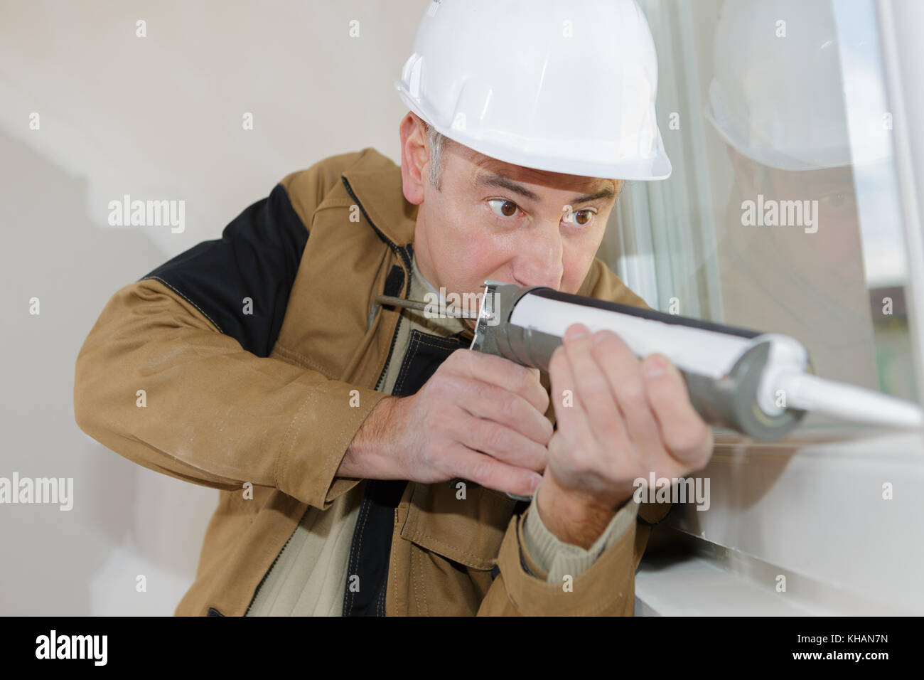construction worker installing window in house Stock Photo - Alamy
